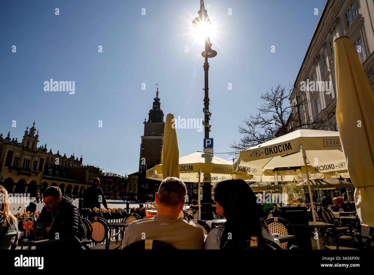 Krakow, Poland on March 20, 2025. People relax in outdoor restaurant in ...