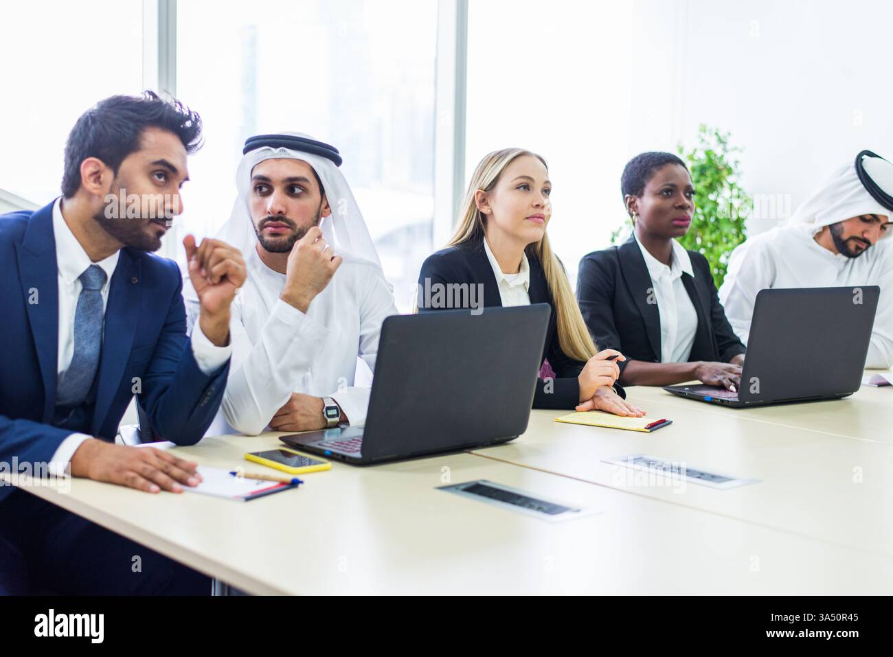 Multiracial group of business people having a meeting in a office ...