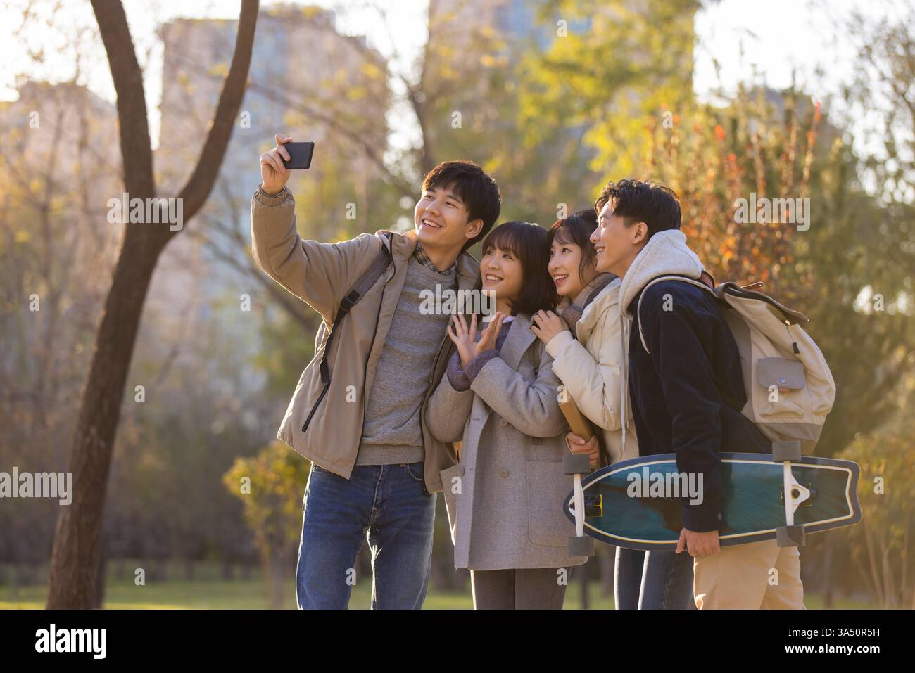 Happy Chinese college students taking selfie on campus Stock Photo - Alamy