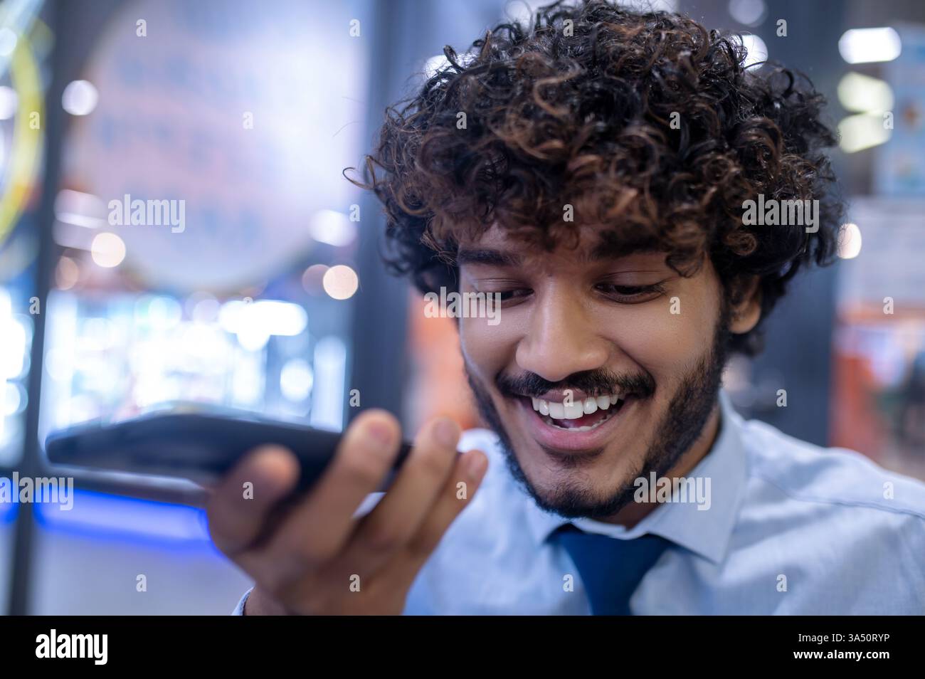 Smiling indian businessman recording hi-res stock photography and ...