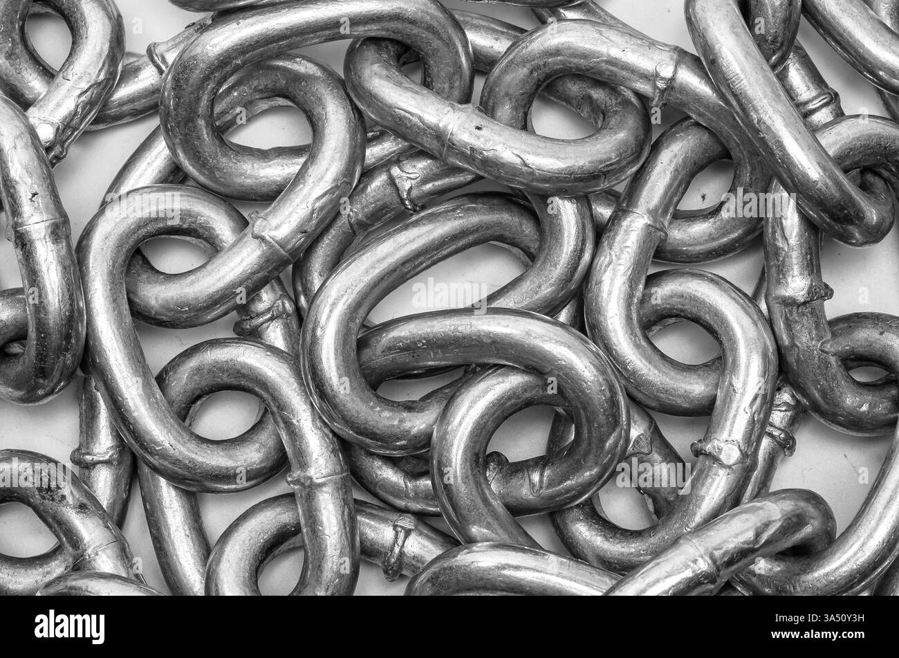Interlinked steel chains with rugged texture in monochrome Stock Photo ...
