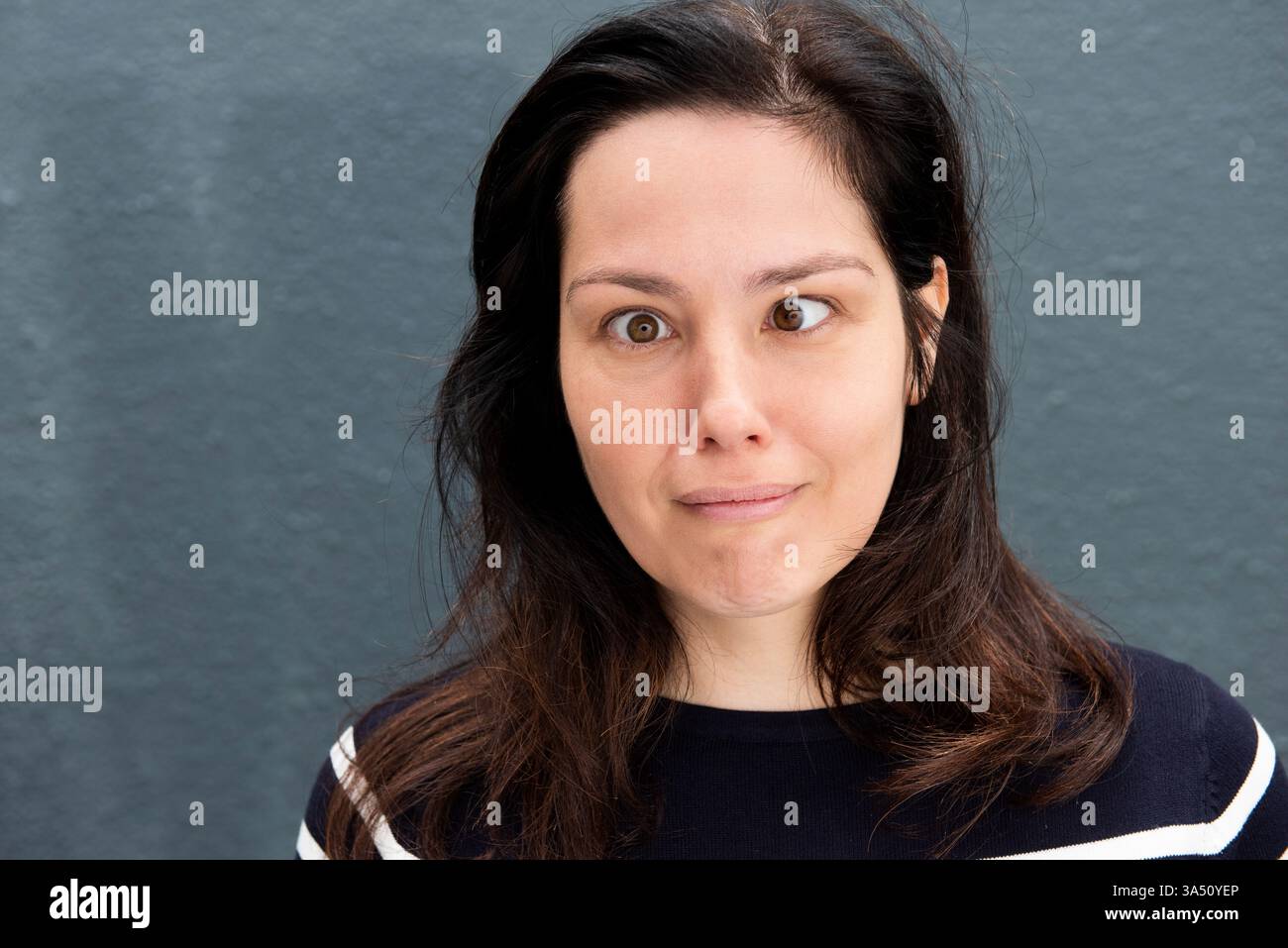 Close up portrait young woman making funny face with eyes crossed Stock ...