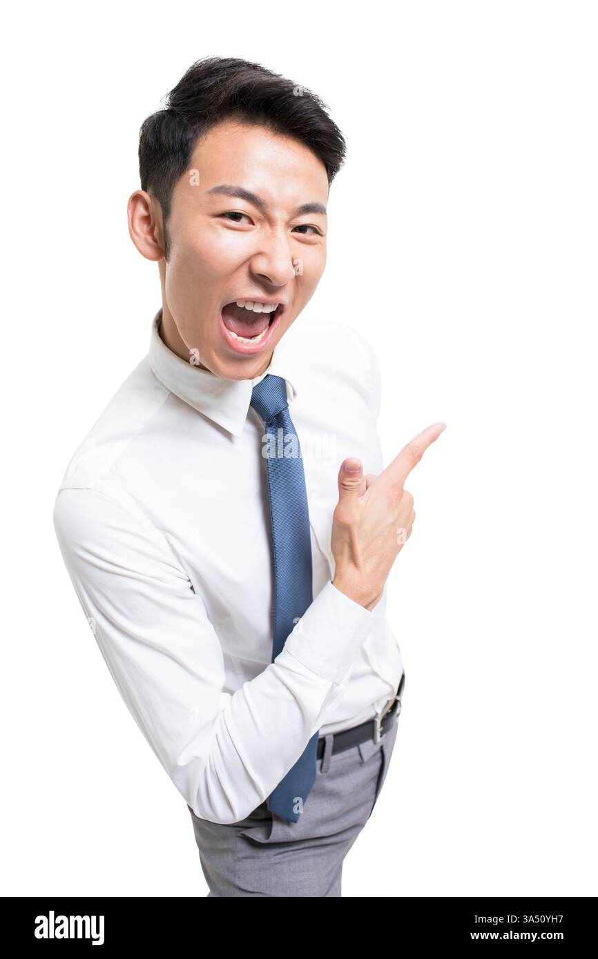 Cheerful Chinese businessman pointing finger backward while standing ...