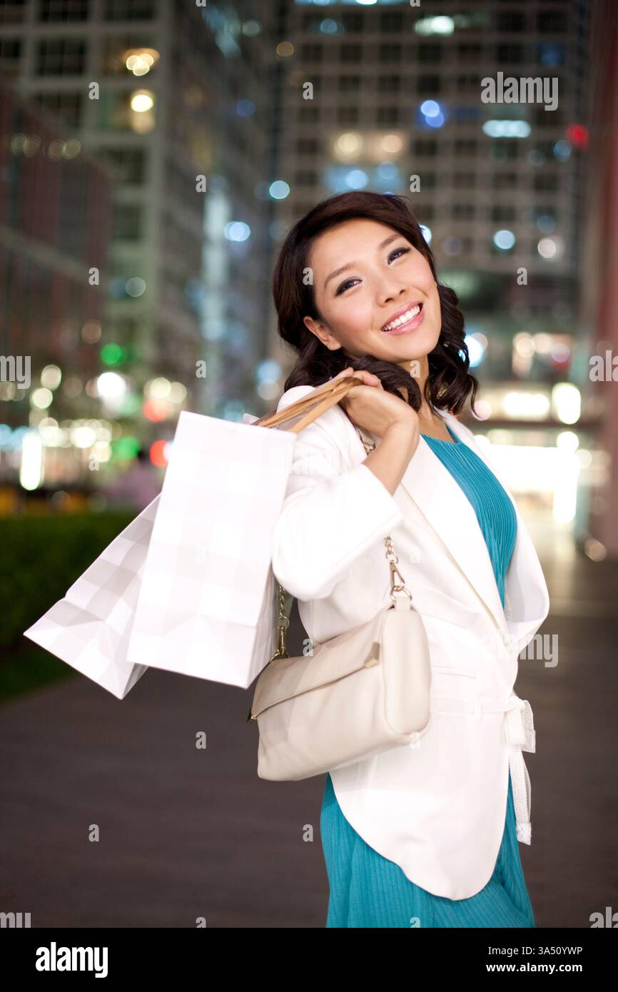 Young Chinese woman go shopping Stock Photo - Alamy