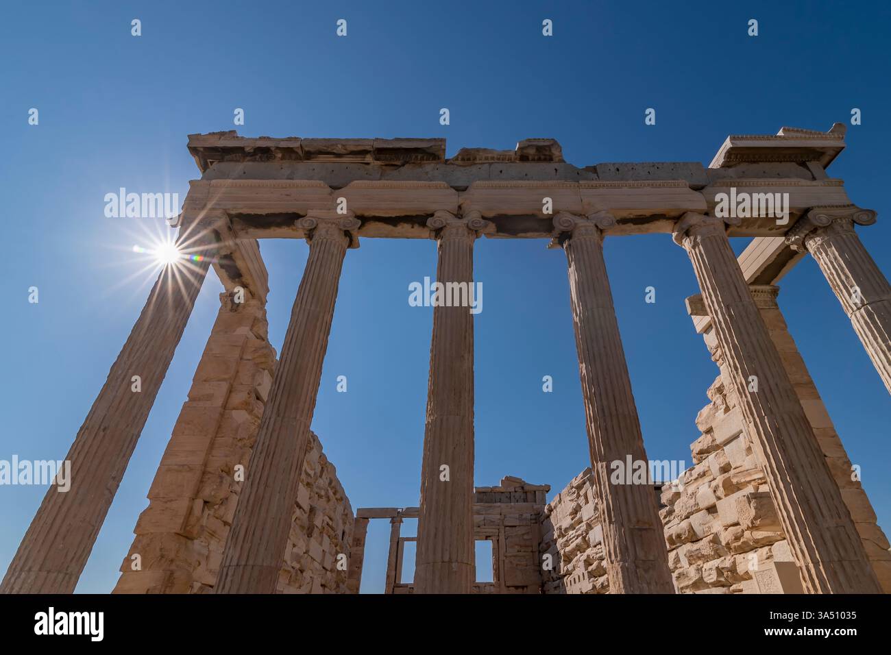 The sun peeks over the Erechtheion, a 5th-century BC Greek Ionic temple ...