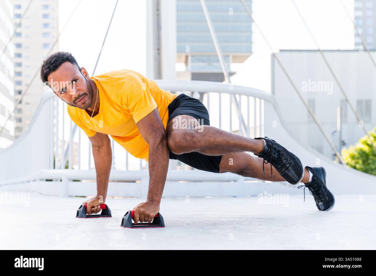 Black hispanic sportsman training outdoors in the city - African man ...