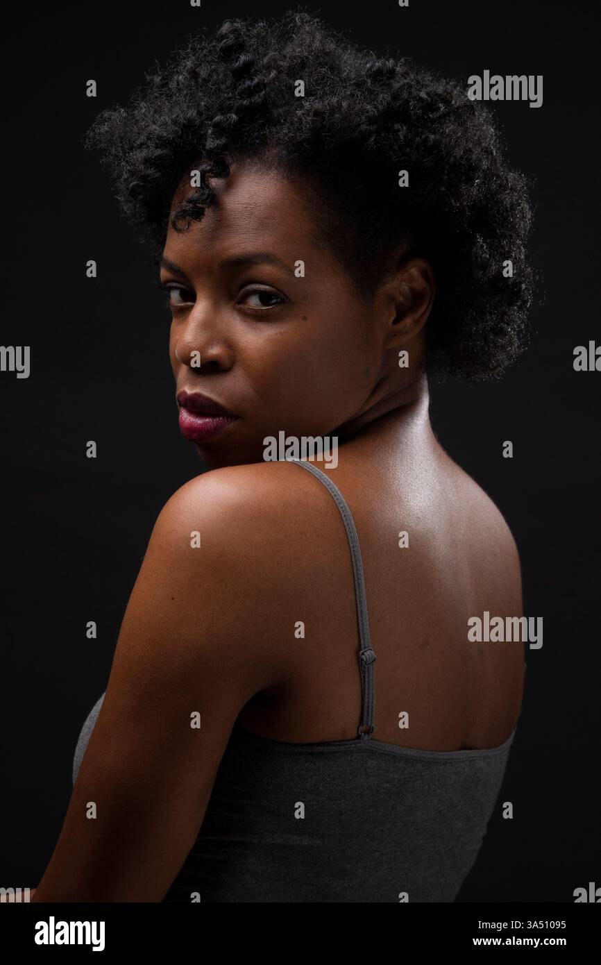 Serious Black woman deeply thinking praying meditating stressed ...