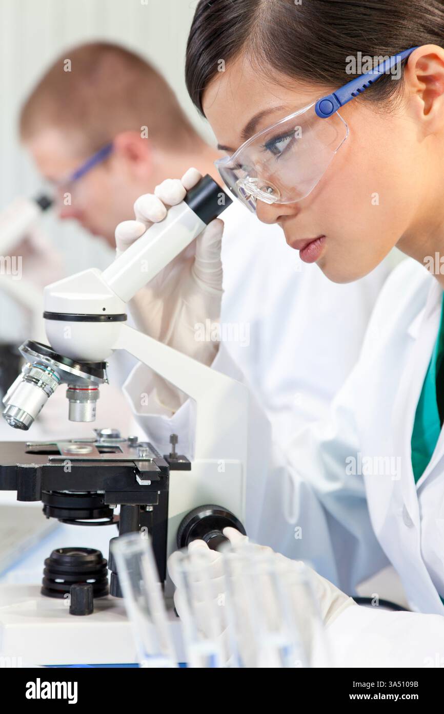 A Chinese Asian female medical or scientific researcher or doctor using ...