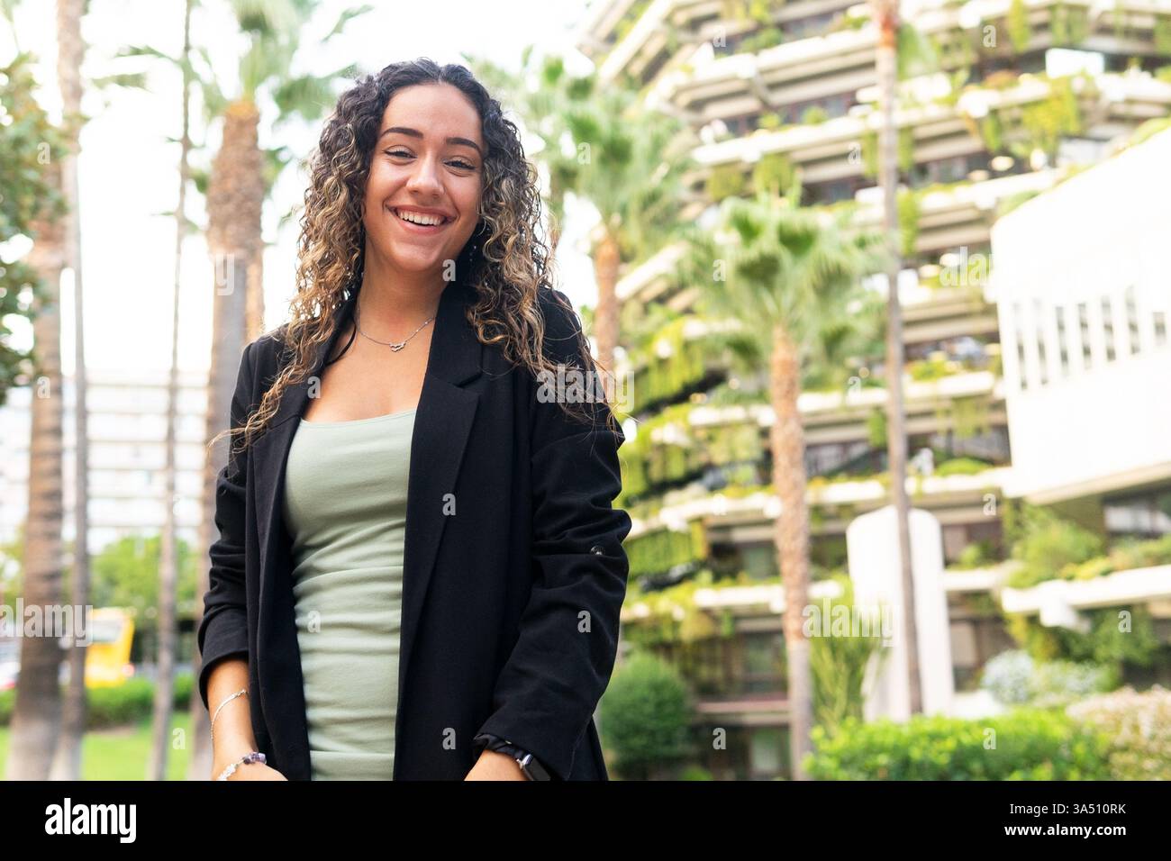 From below self assured young Hispanic businesswoman in stylish black ...