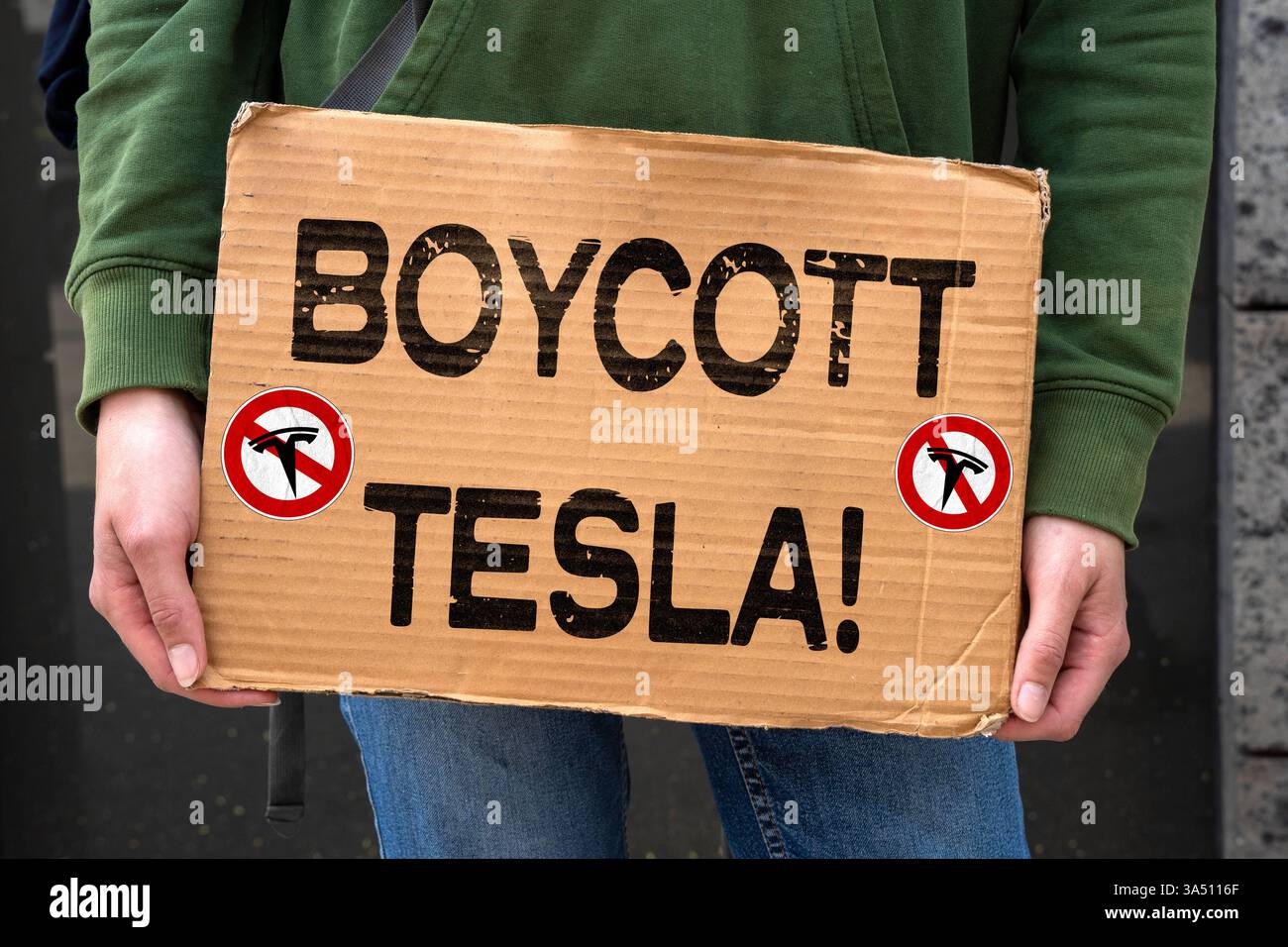 March 20, 2025: PHOTOMONTAGE, A woman holds a poster with the ...