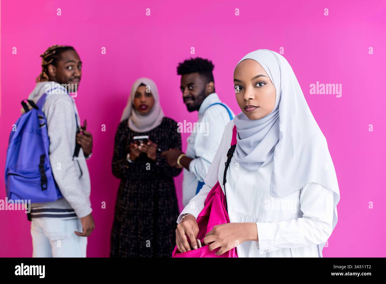 african students group using smart phones with plastic pink background ...
