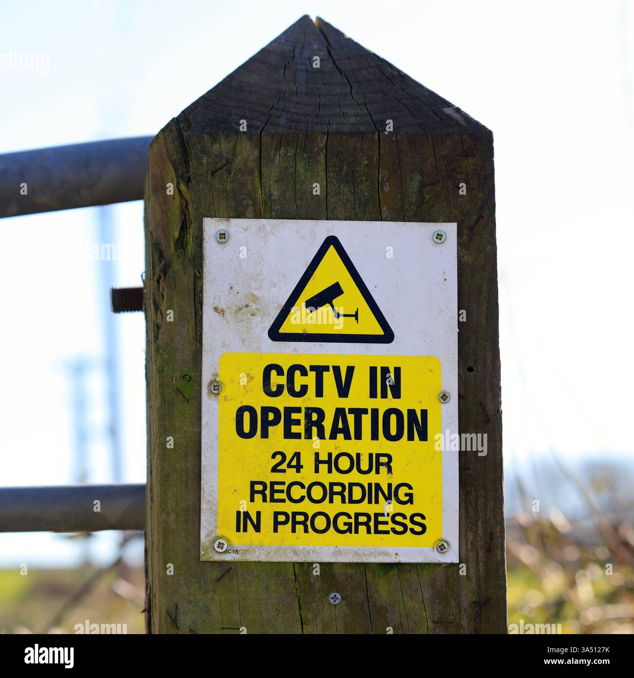 Sign on gatepost warning of CCTV in Operation - 24 hour recording in ...