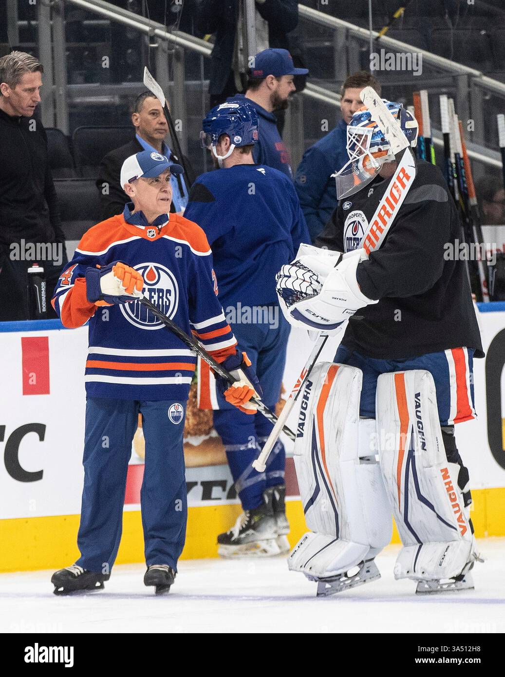 Canadian Prime Minister Mark Carney skates with Edmonton Oilers goalie ...
