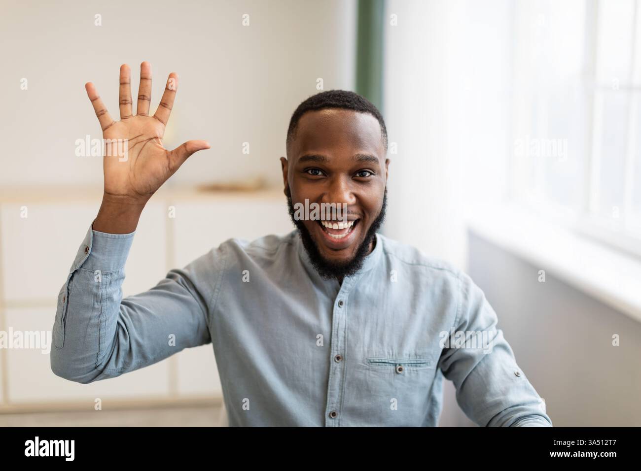 Hello. Joyful Black Businessman Waving Hand Smiling To Camera Posing ...