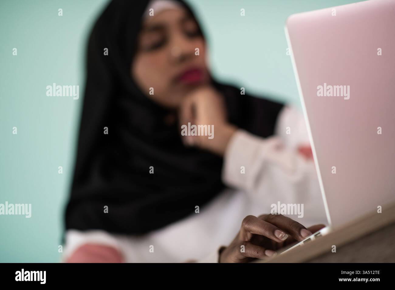 Sad female dressmaker sitting hi-res stock photography and images - Alamy