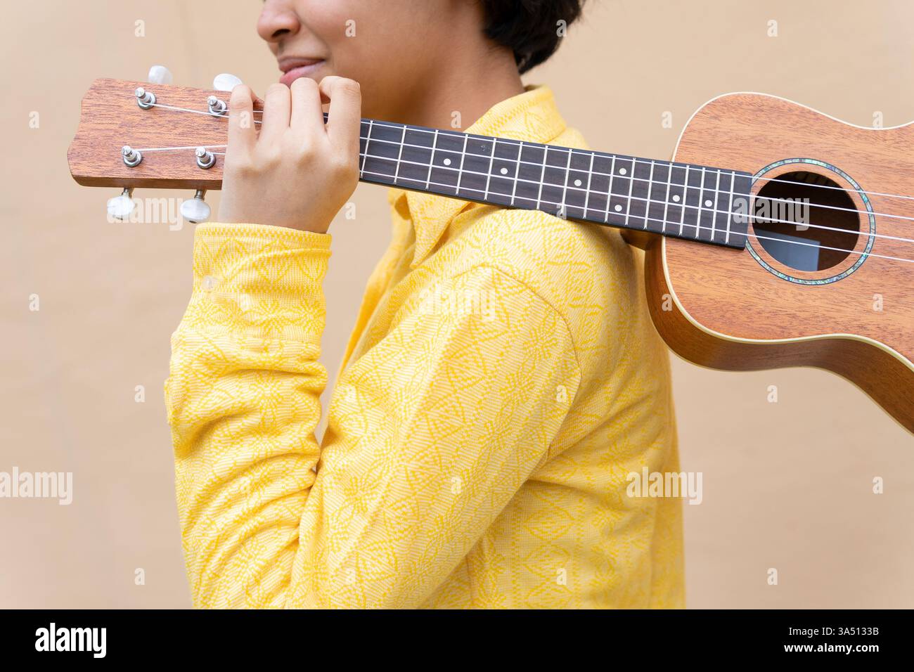 Side view of cropped unrecognizable charming female with short curly ...