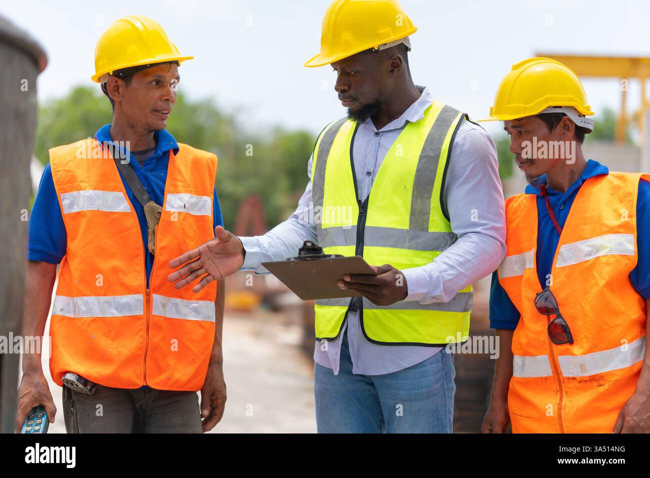 Foreman and workers team meeting for planning a project at a ...