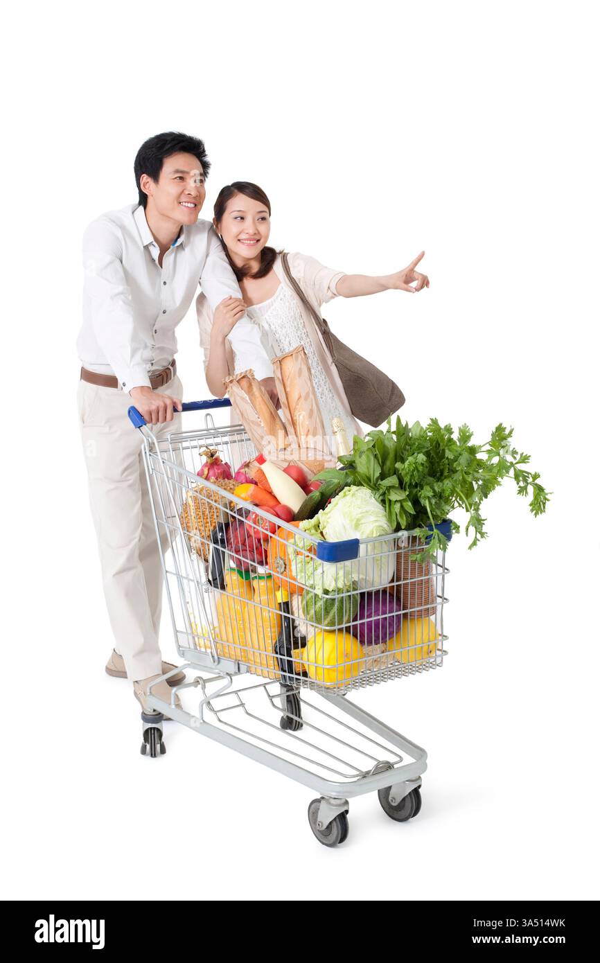 Young Chinese couple grocery shopping Stock Photo - Alamy