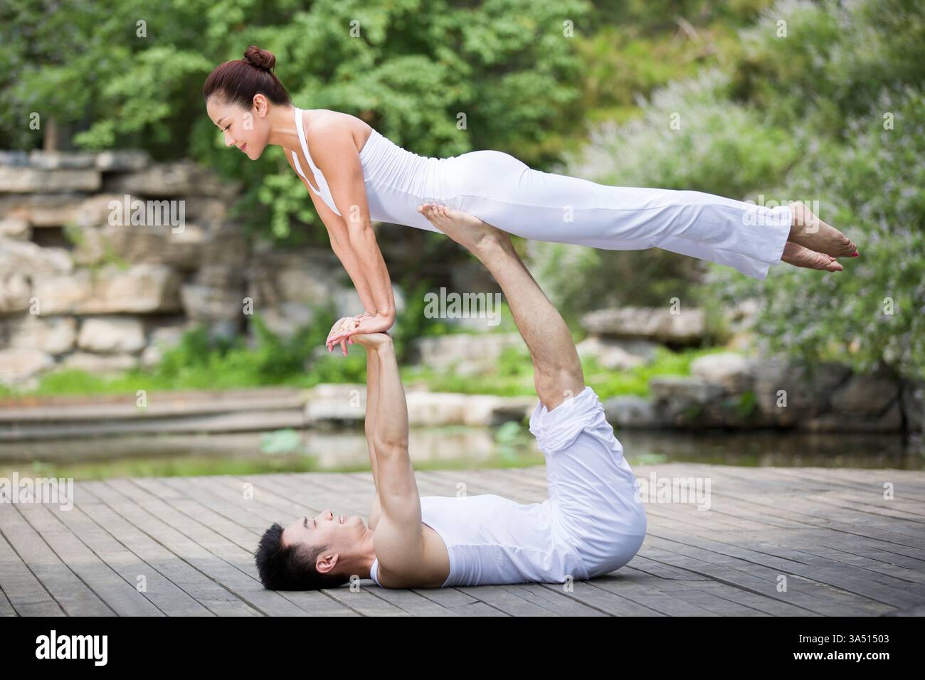Two women demonstrating yoga poses hi-res stock photography and images ...