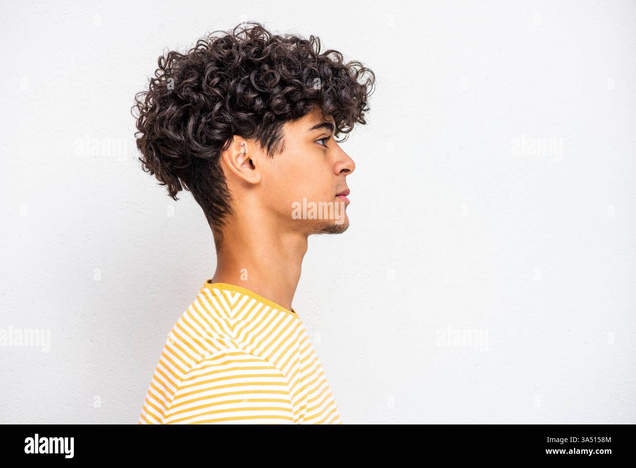 Profile portrait young North African man against white background Stock ...
