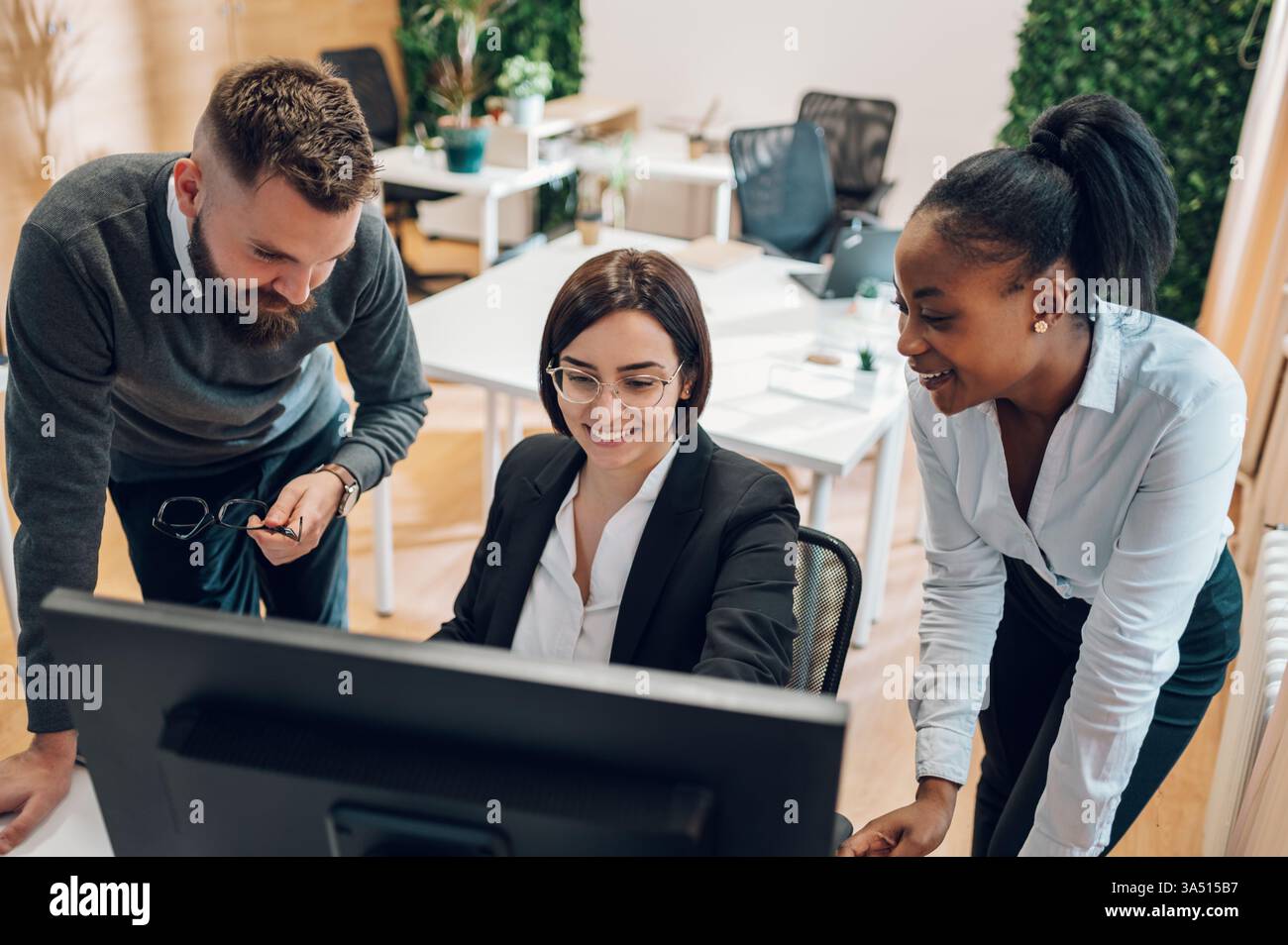 Smiling Black business woman leaning forward and discussing corporate ...