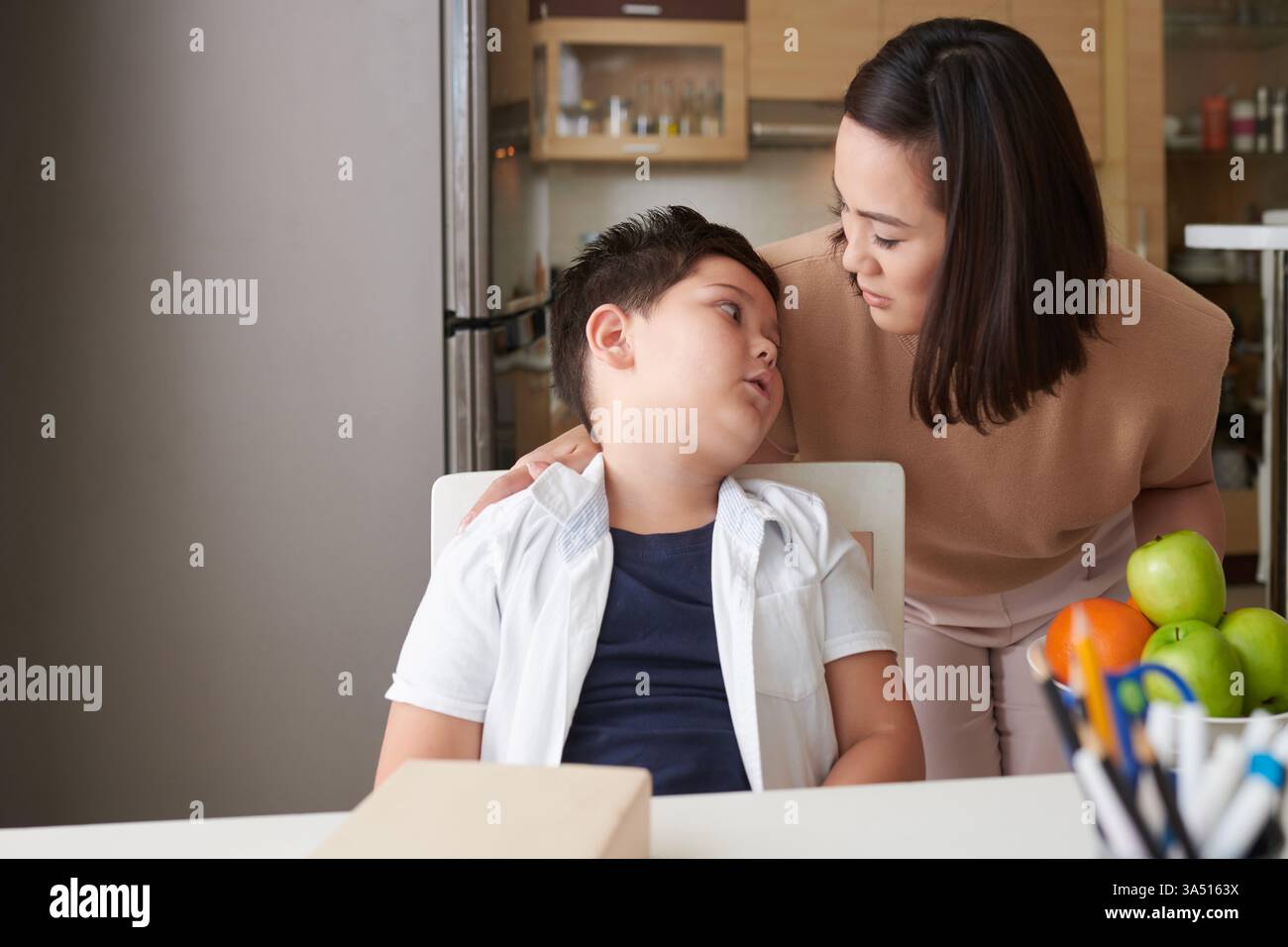 Tired boy complaining mother about difficult assignments Stock Photo ...