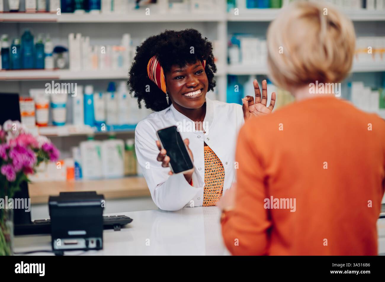 African american client holding hi-res stock photography and images - Alamy