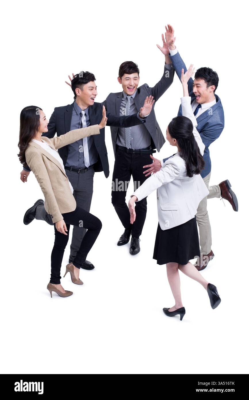 Chinese business people giving high five to each other celebrating ...