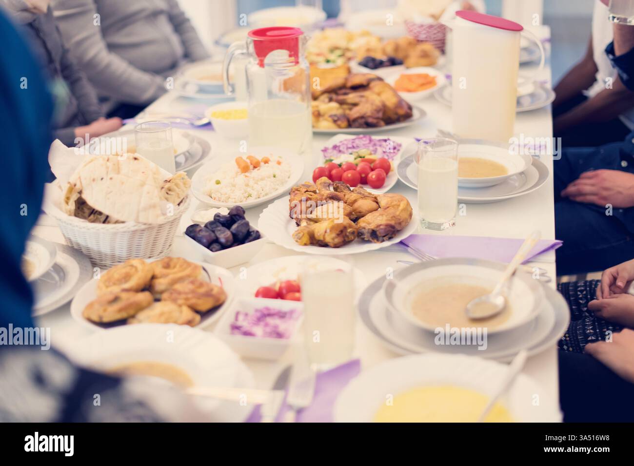 modern multiethnic muslim family enjoying eating iftar dinner together ...