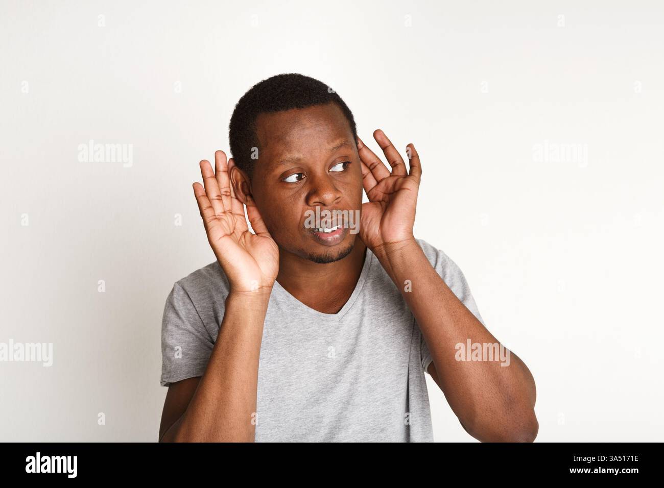 Owerhearing black man, human emotions. Black guy eavesdropping secrets ...