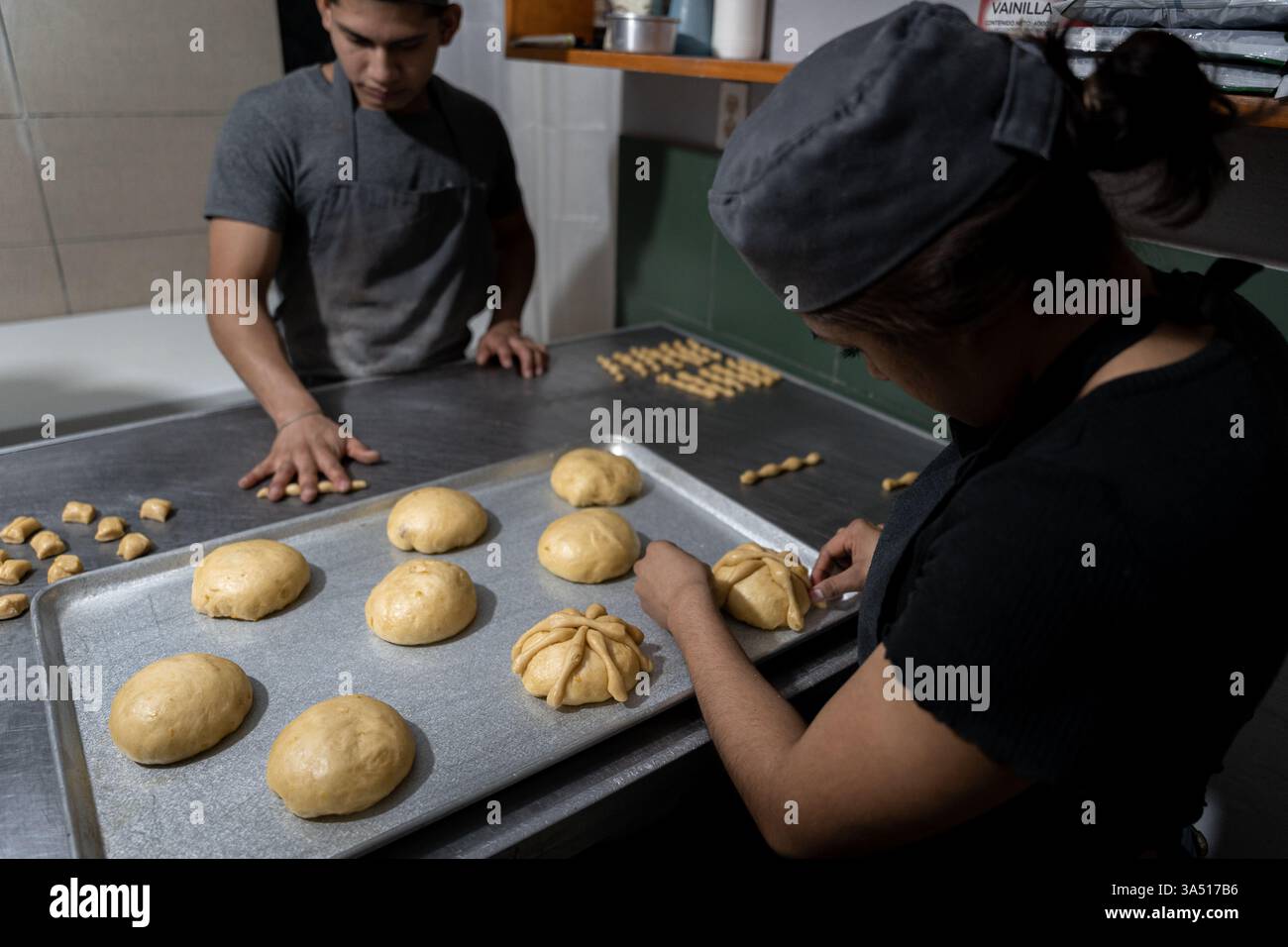Baker places bread dough in hi-res stock photography and images - Alamy