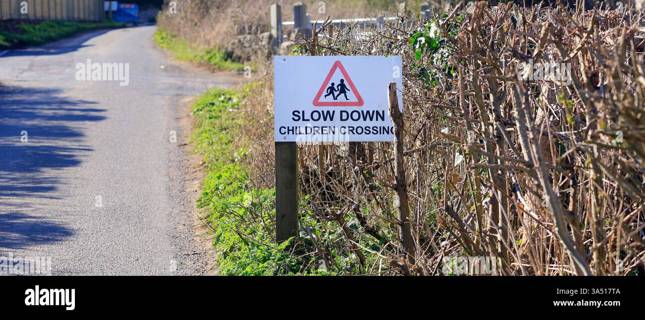 Slow Down Children Crossing sign on a country road. Taken March 2025 ...
