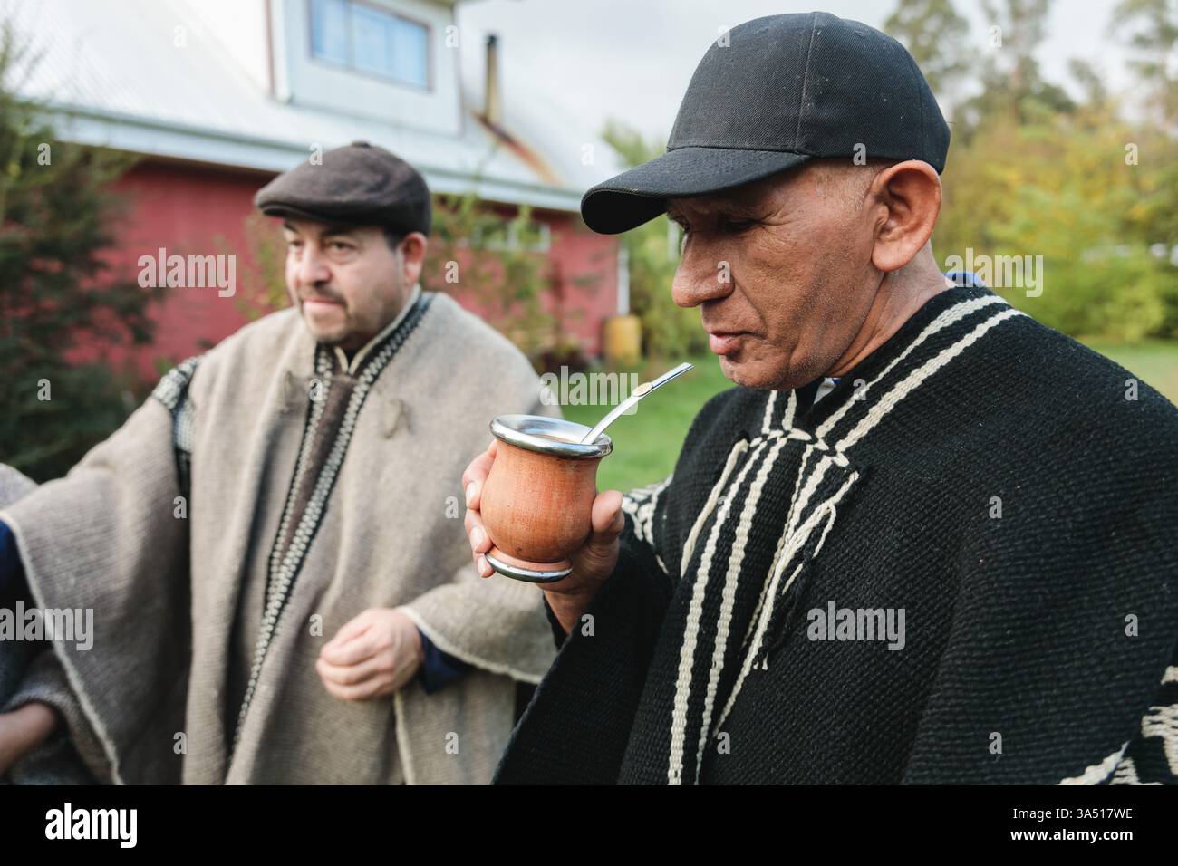 Thoughtful senior men in traditional Mapuche clothing and beret looking ...