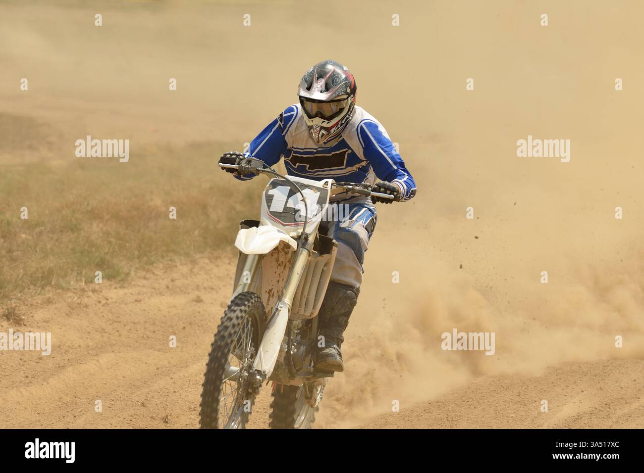 High-energy action shot of a motocross rider in an outdoor race ...