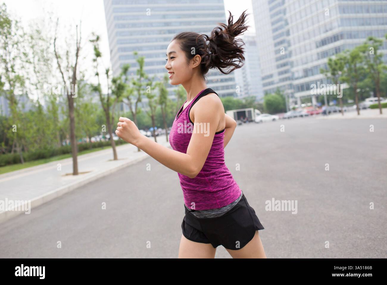 Woman running outside hi-res stock photography and images - Alamy
