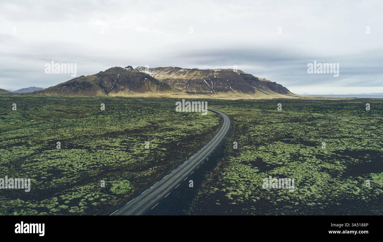 View of mountain and long country road during daytime Stock Photo - Alamy