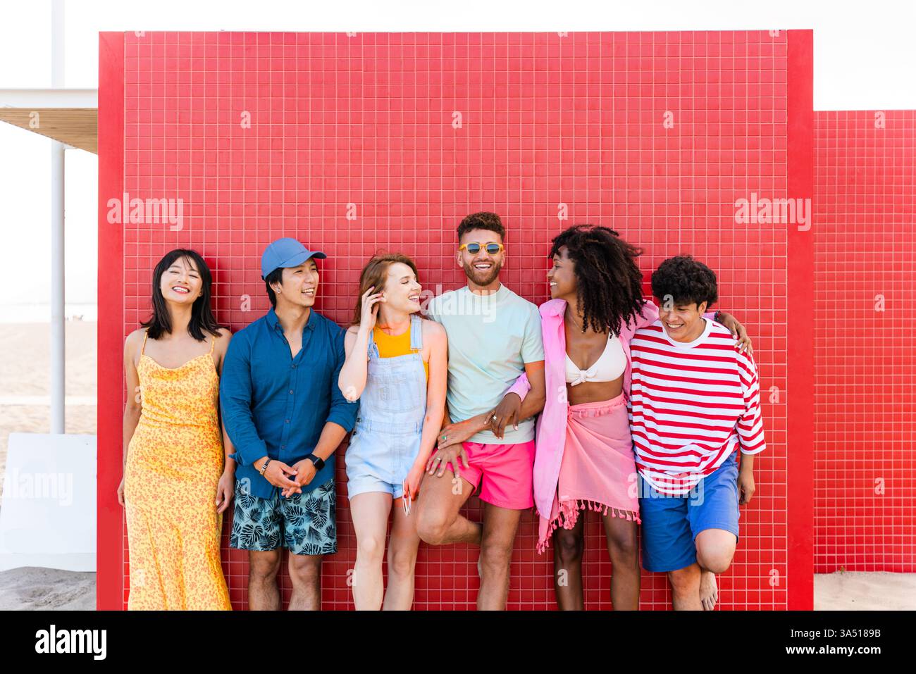 Multiethnic group of young happy friends bonding outside, having fun on ...