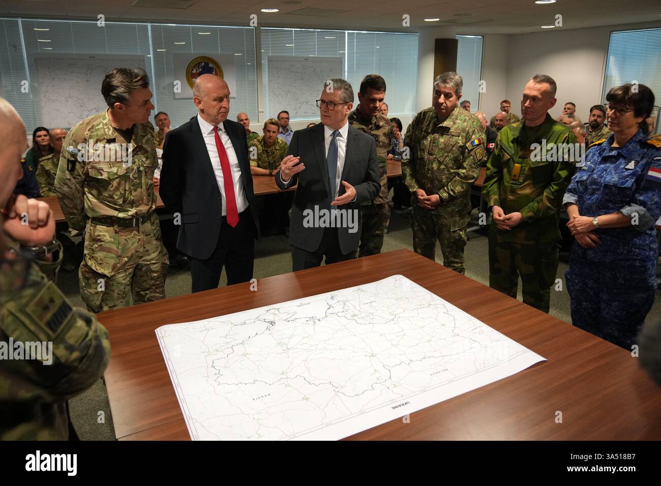 Prime Minister Sir Keir Starmer (center right) and Defence Secretary ...
