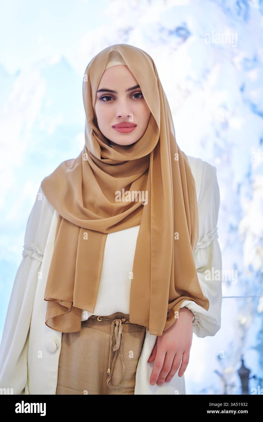 Girl wearing hijab posing on winter concept background. Portrait of ...