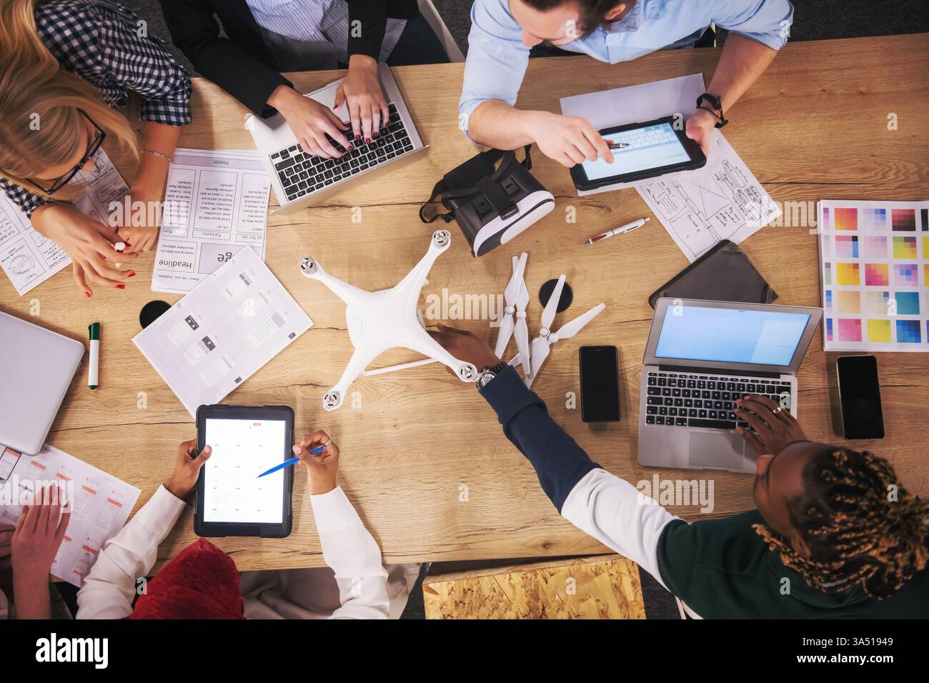 Diverse group of business people having a meeting while sitting ...