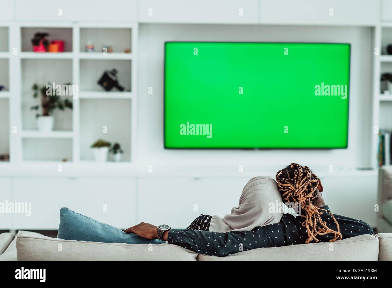 African Couple Sitting On Sofa Watching TV Together Chroma Green Screen ...