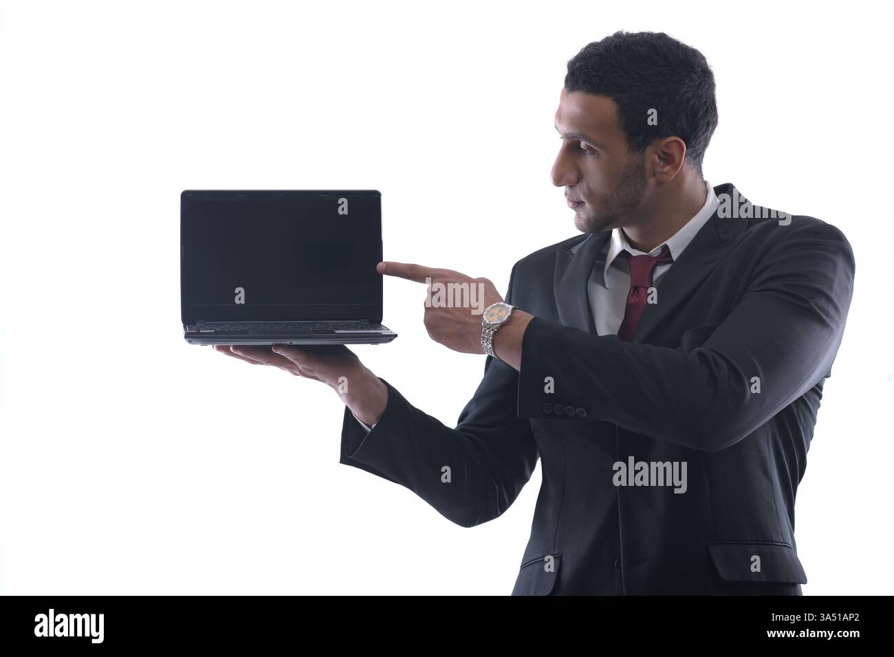 Serious Middle Eastern businessman hold and pointing on laptop computer ...