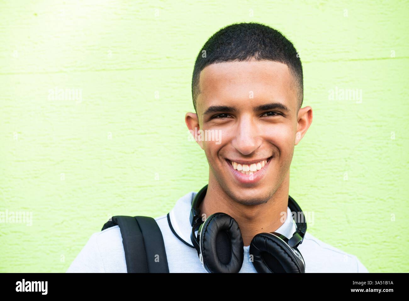 Close up horizontal portrait smiling young arab man with headphones ...