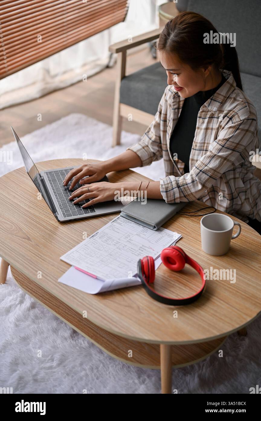 Young woman focuses on computer hi-res stock photography and images - Alamy