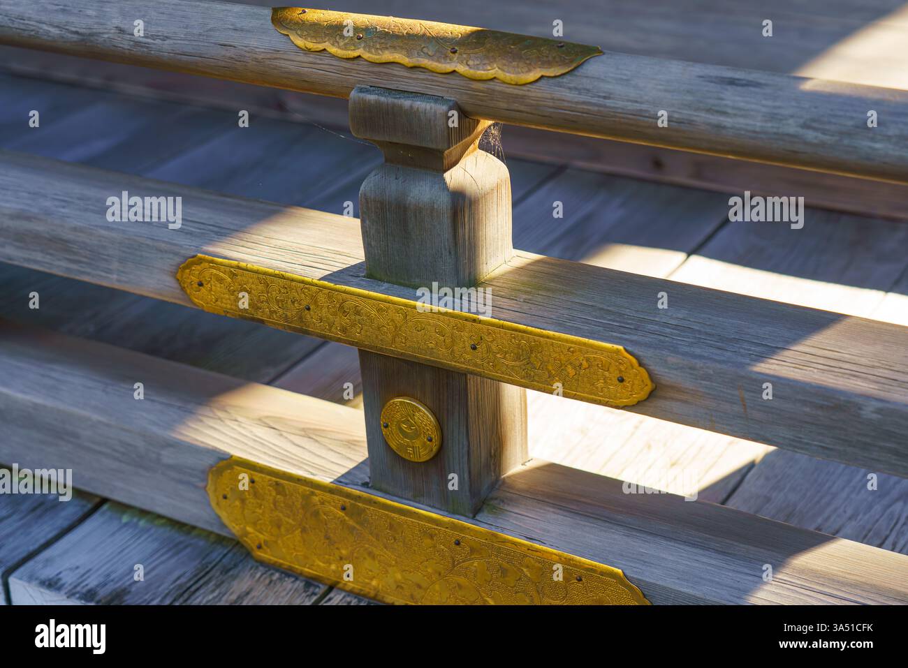 Kyoto, Japan - Sep 23 2024, A close-up view of a wooden railing covered ...