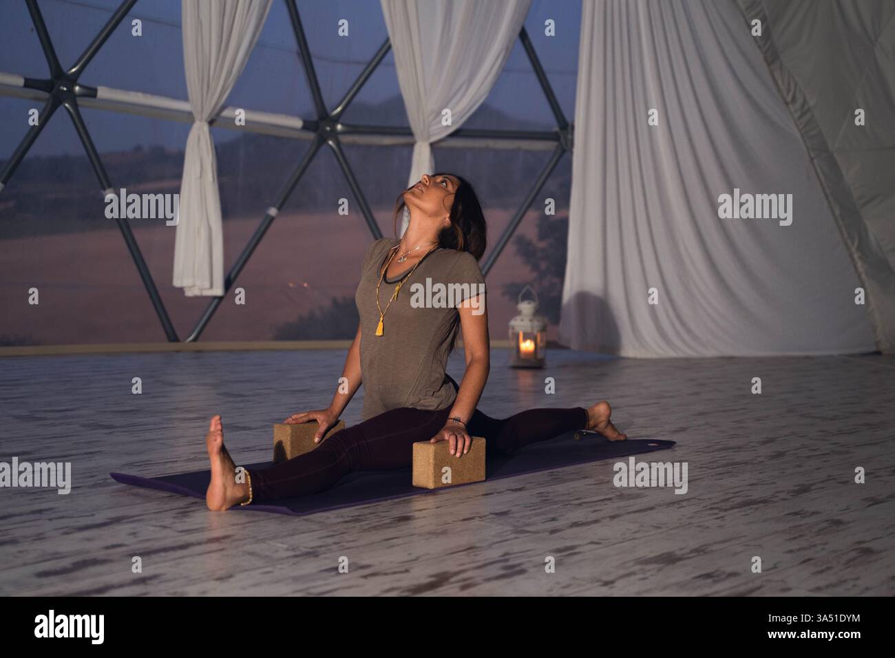 Young hispanic woman tilts head hi-res stock photography and images - Alamy