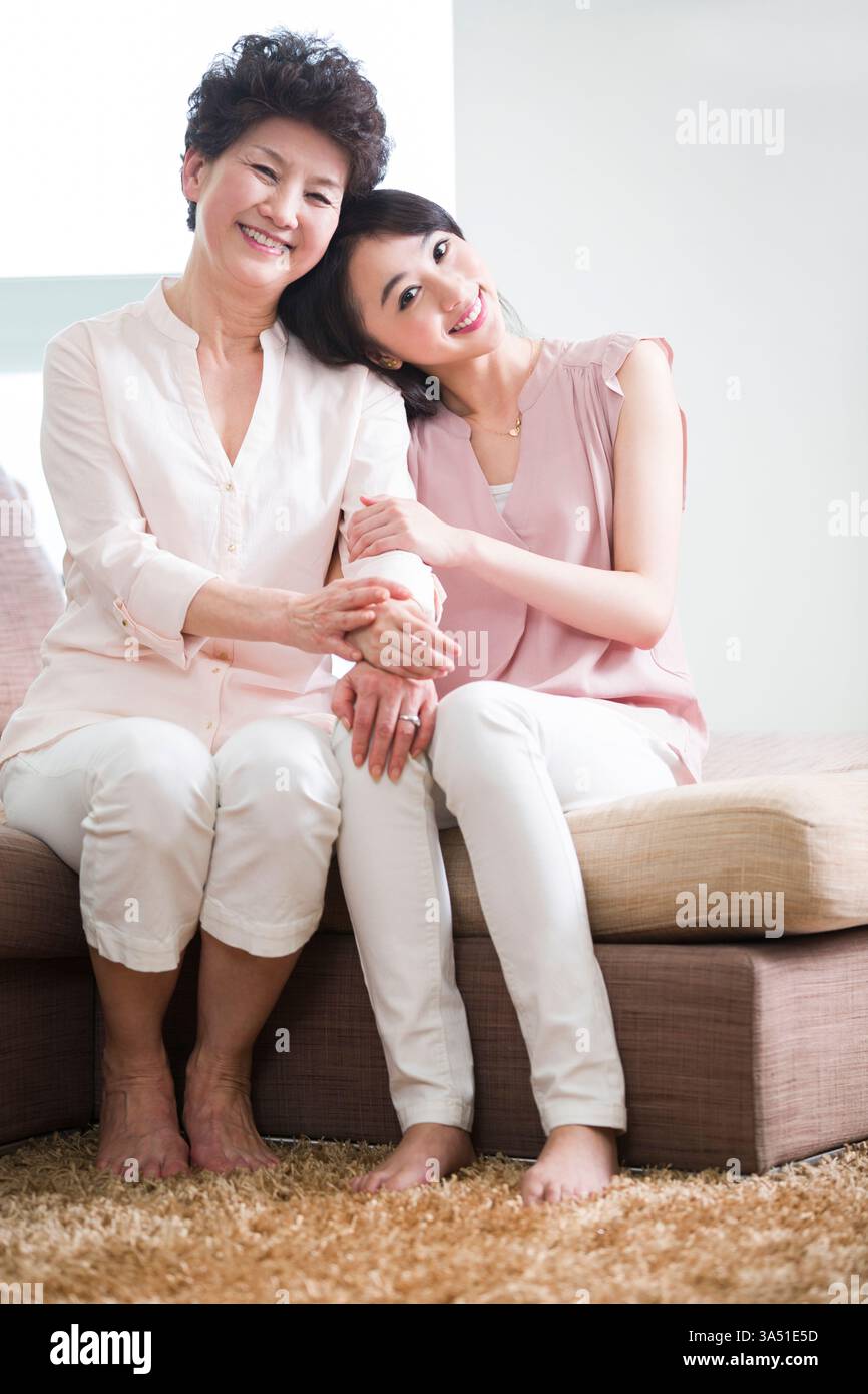 Happy Chinese mother and daughter smiling Stock Photo - Alamy