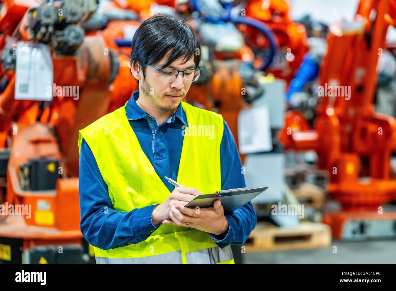 Manager of a industrial robots at the automated manufacturing factory ...