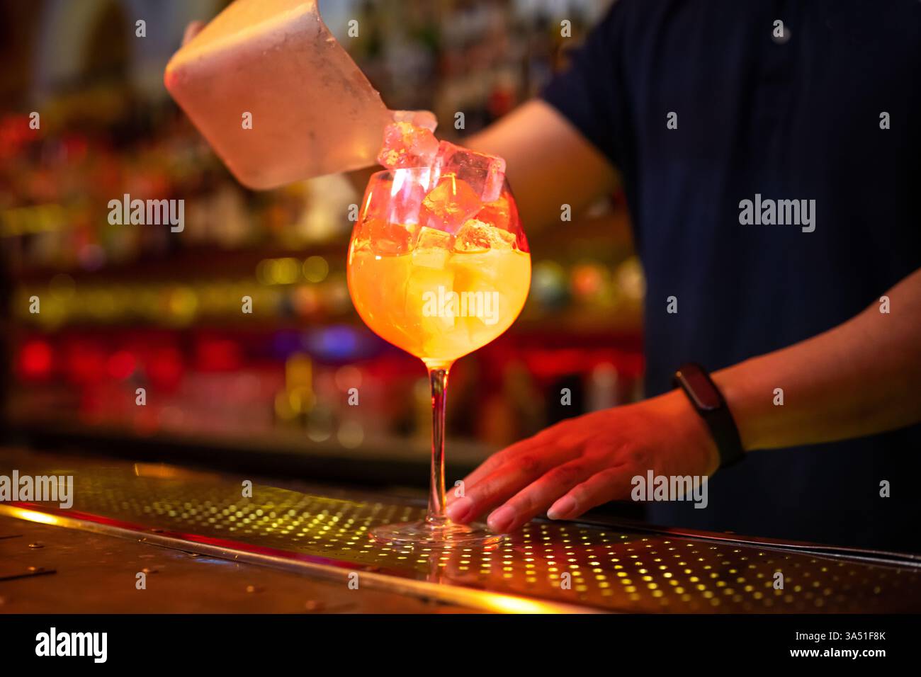 Male bartender putting ice hi-res stock photography and images - Alamy