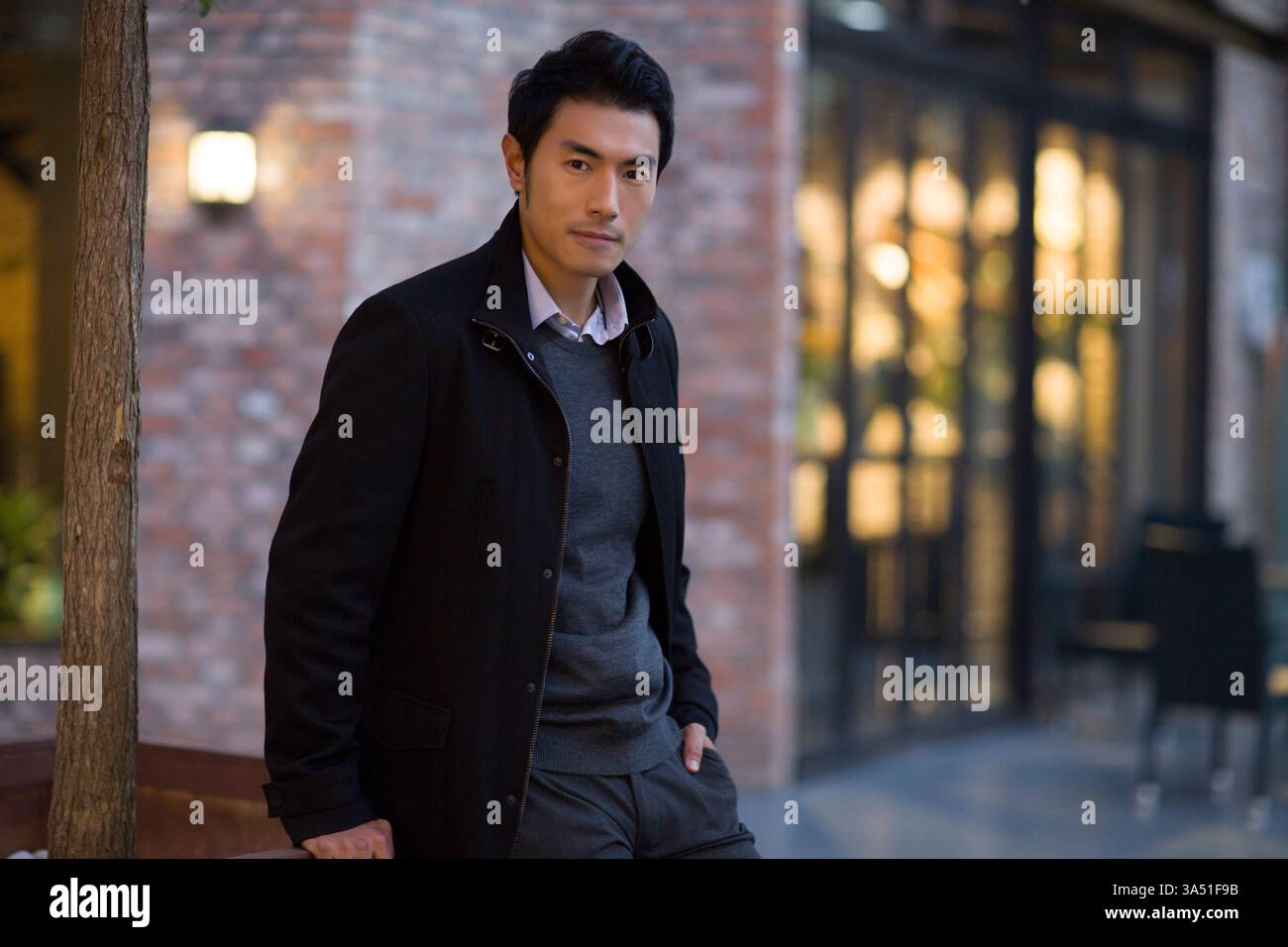 Portrait of young Chinese man Stock Photo - Alamy